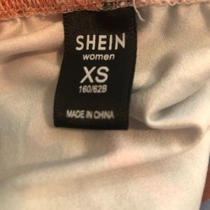 SHEIN | Skirts | Nwot Shein Art Faces Mini Skirt | Poshmark